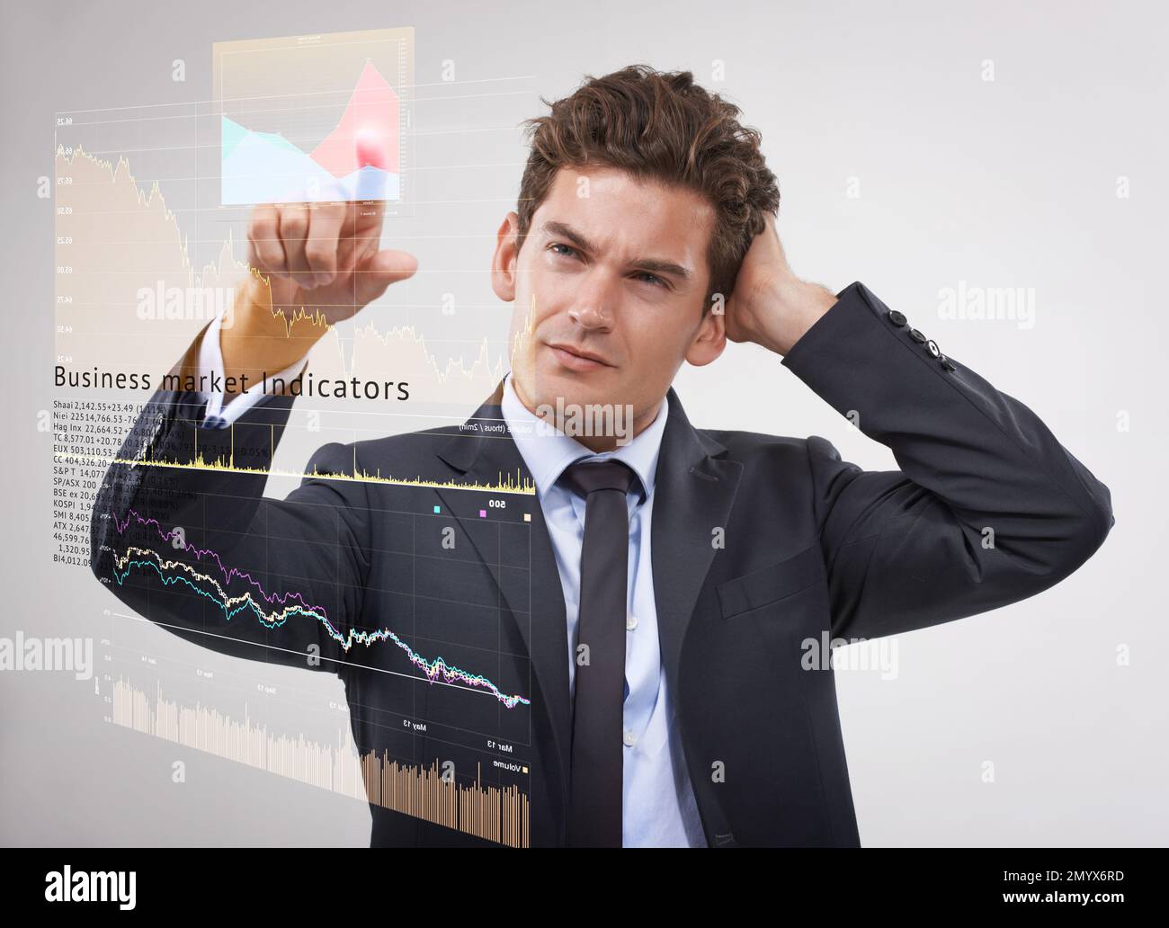 Confused by the numbers. a thoughtful-looking businessman using a ...