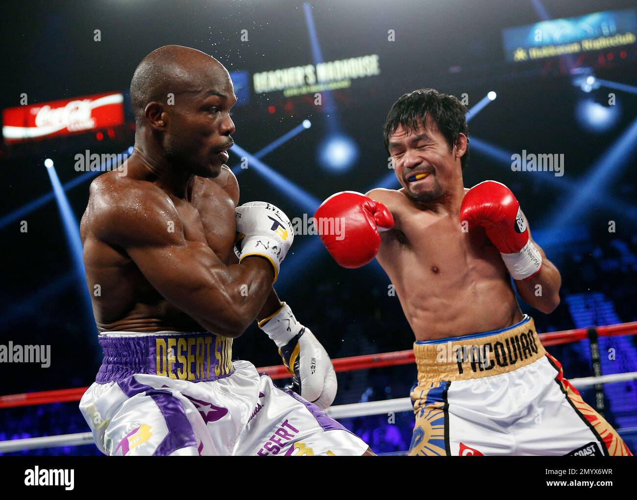 Manny Pacquiao, right, of the Philippines, throws a right at Timothy ...