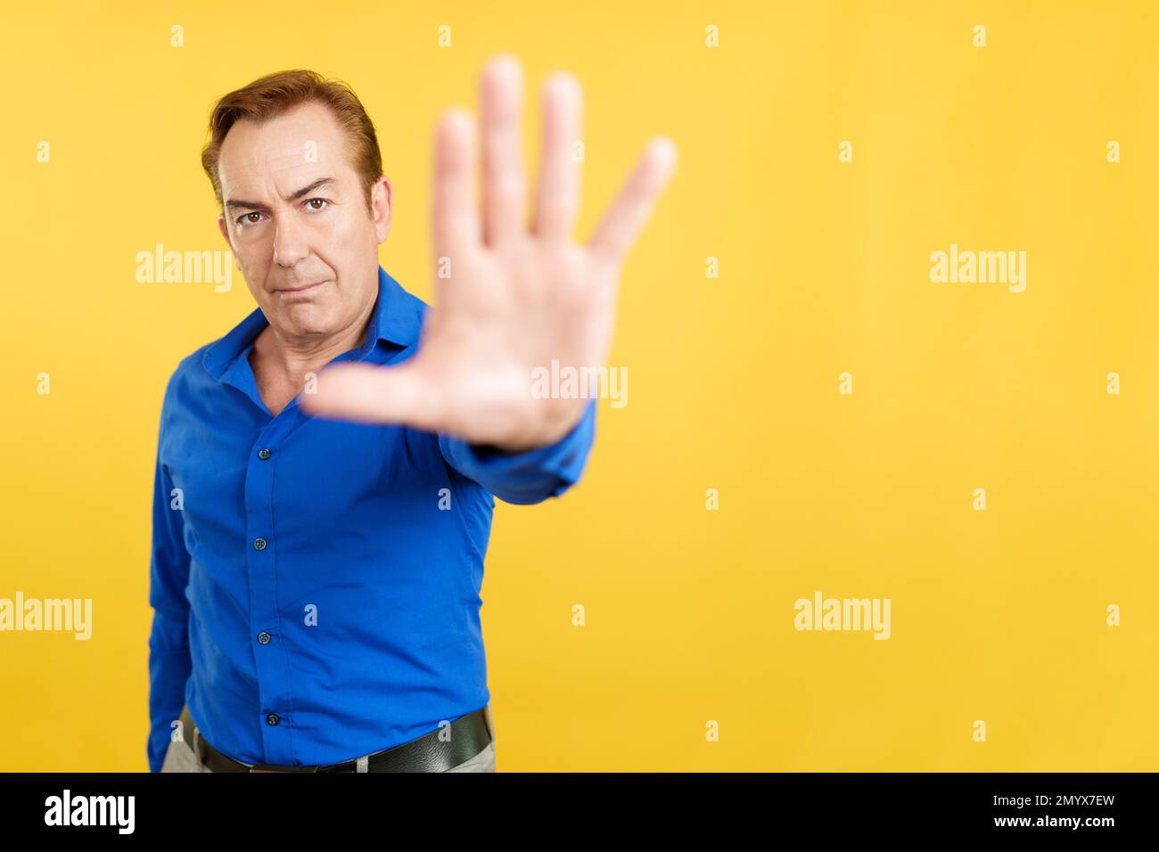 Mature man rejecting with the palm of the hand Stock Photo - Alamy