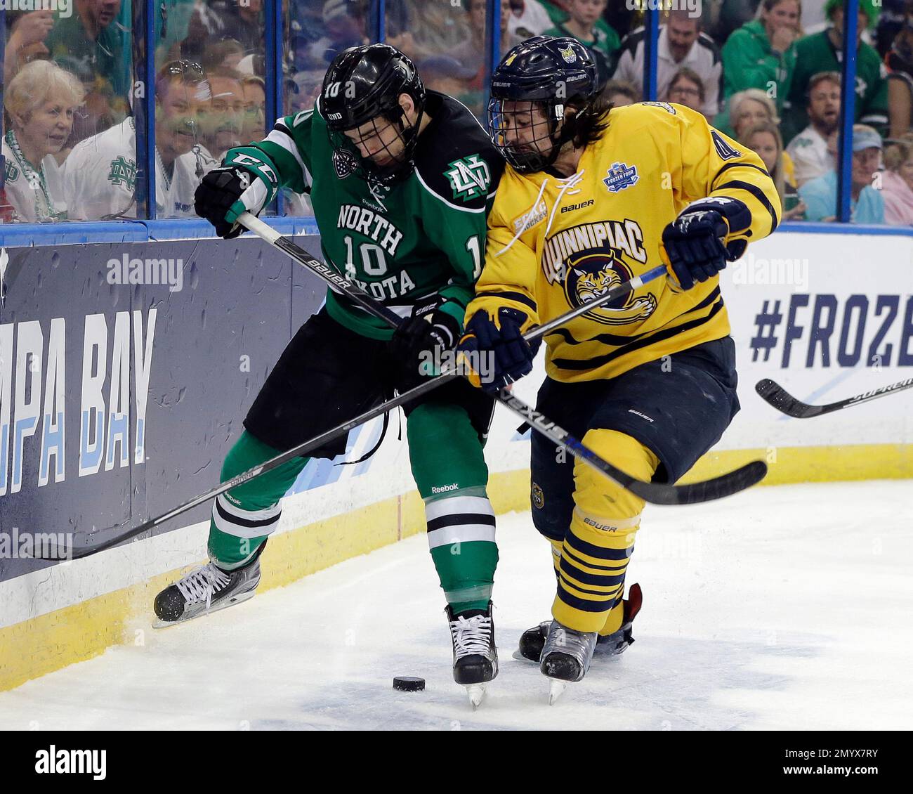 North Dakota forward Johnny Simonson (10) and Quinnipiac defenseman ...