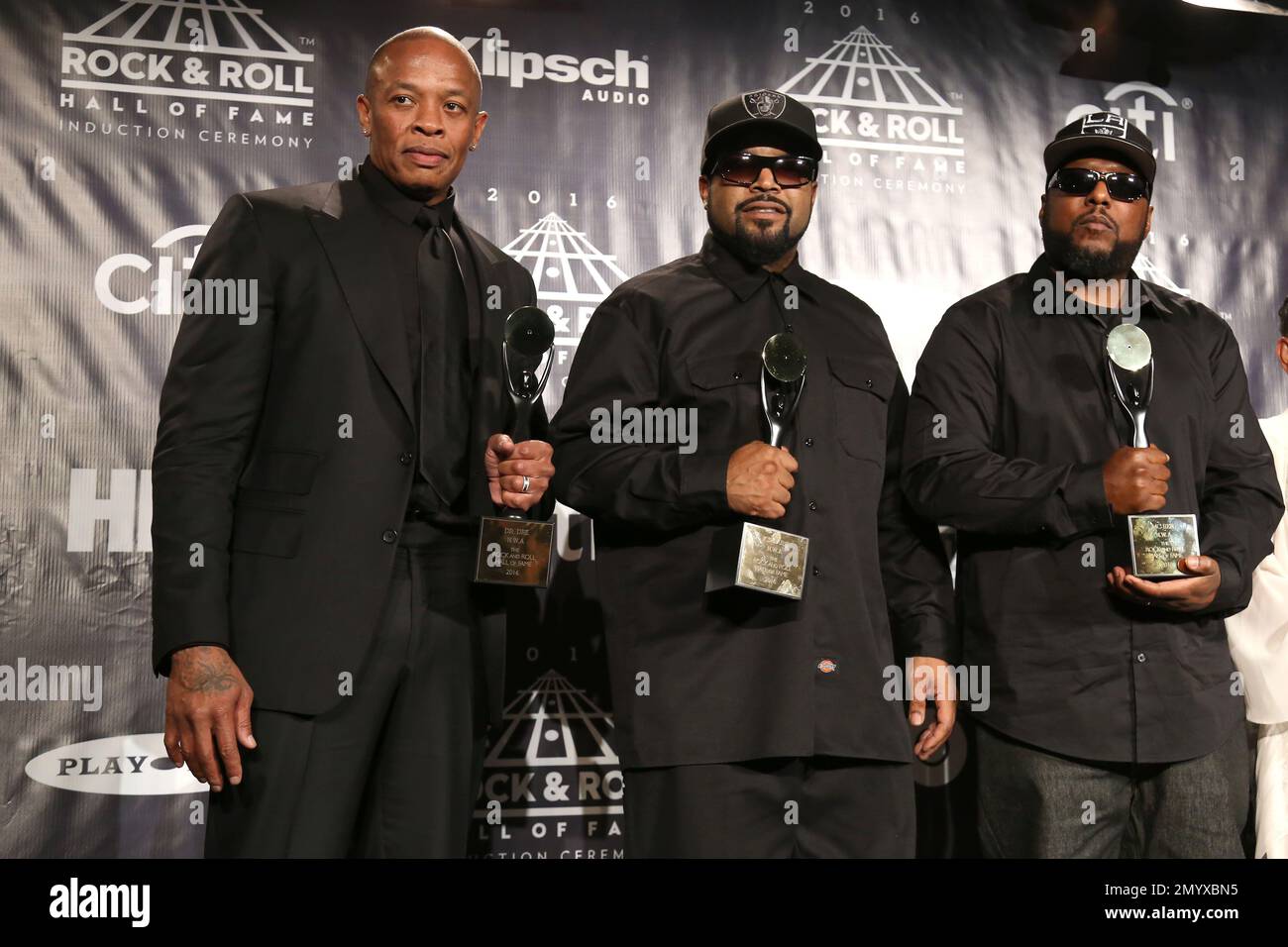 Dr. Dre, from left, Ice Cube and MC Ren of N.W.A pose in the press room ...