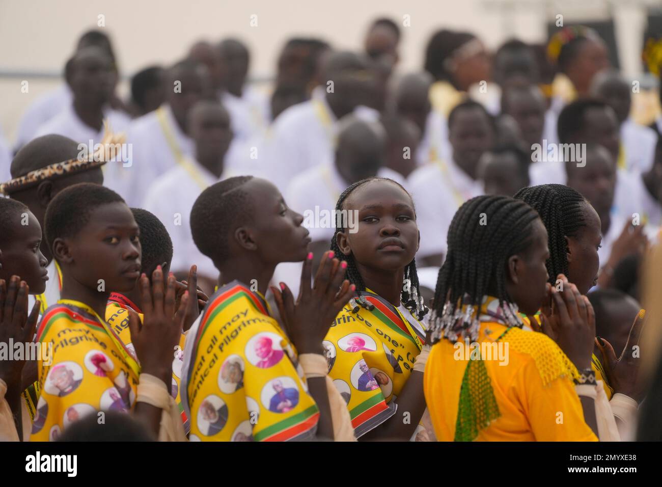 People pray as Pope Francis celebrates mass at the John Garang ...