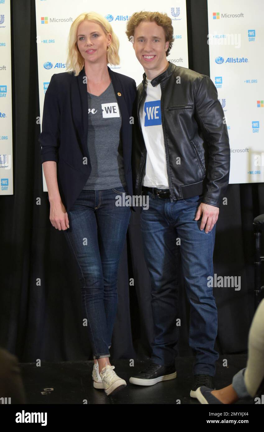 Charlize Theron, left and Craig Kielburger, WE Day co-founder, pose ...