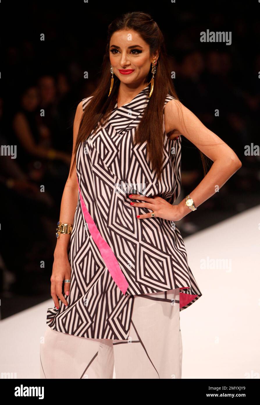 A Pakistani model presents a creation by designer Deepak Perwani during ...