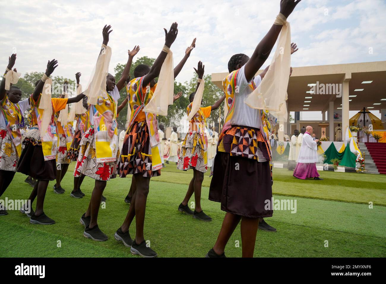 People pray as Pope Francis celebrates mass at the John Garang ...
