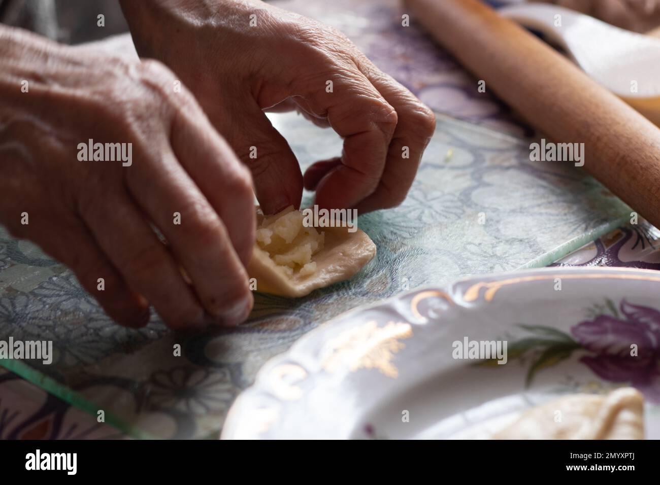 Old woman making pies dough hi-res stock photography and images - Alamy