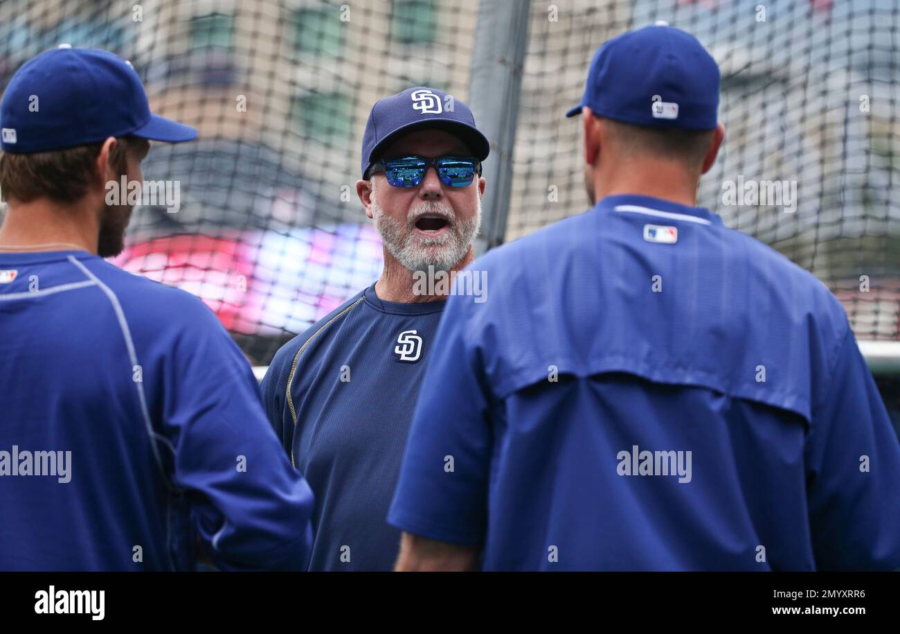 San Diego Padres coach Mark McGwire jokes with former teammates from ...