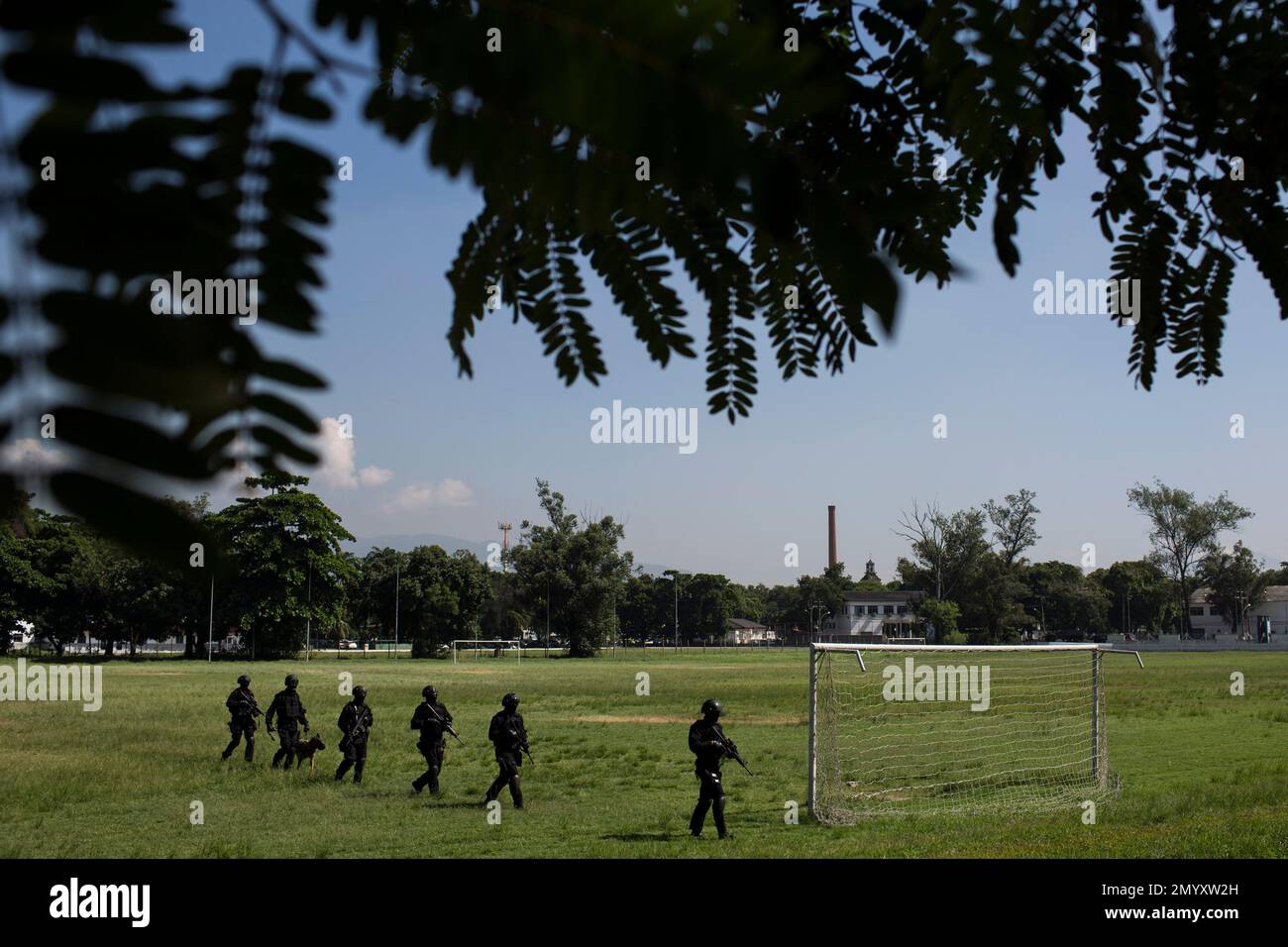 A Brazilian Army special operations squad walks across a soccer field ...
