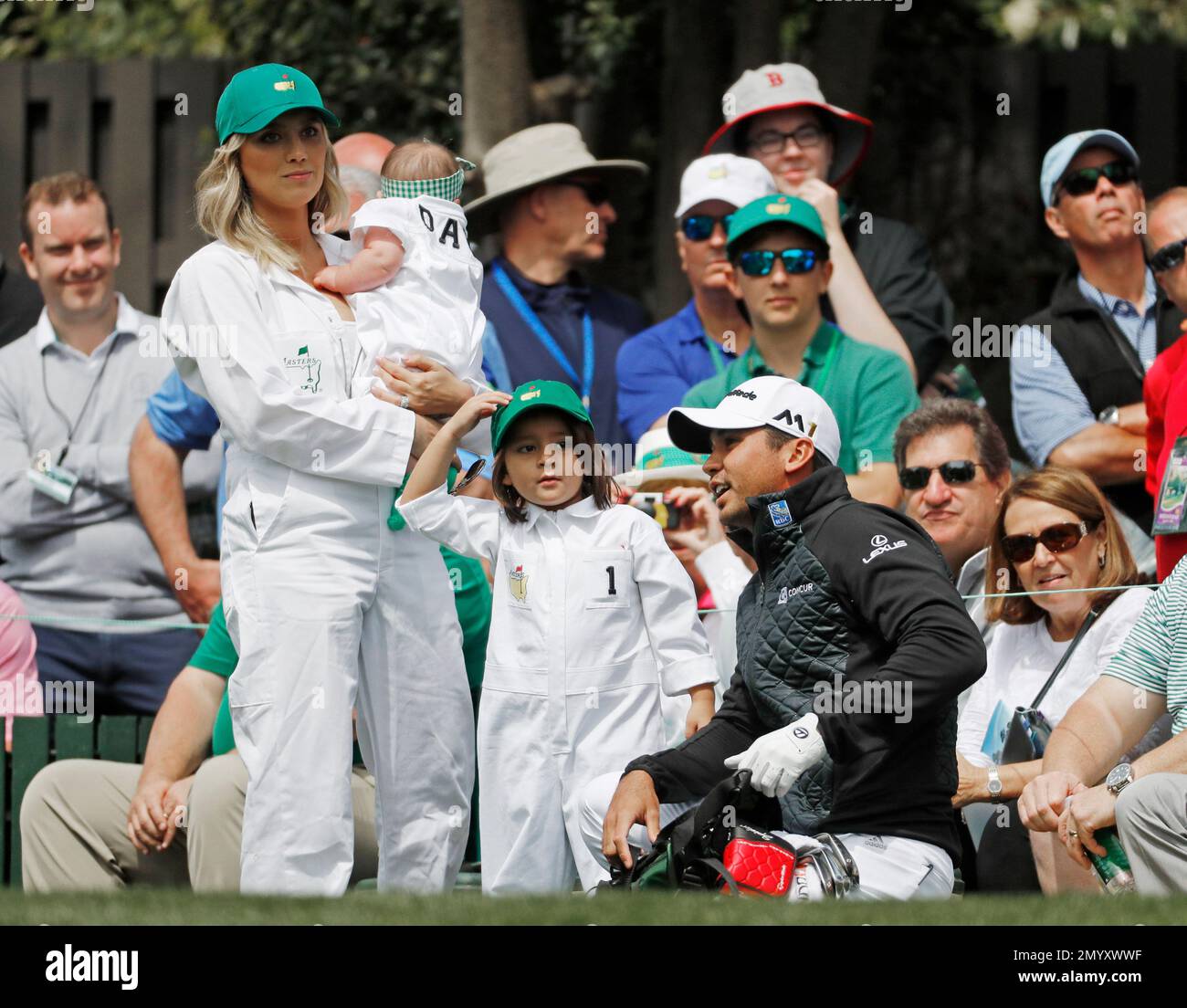 Jason Day, of Australia, sits with his wife Ellie Harvey and their son ...