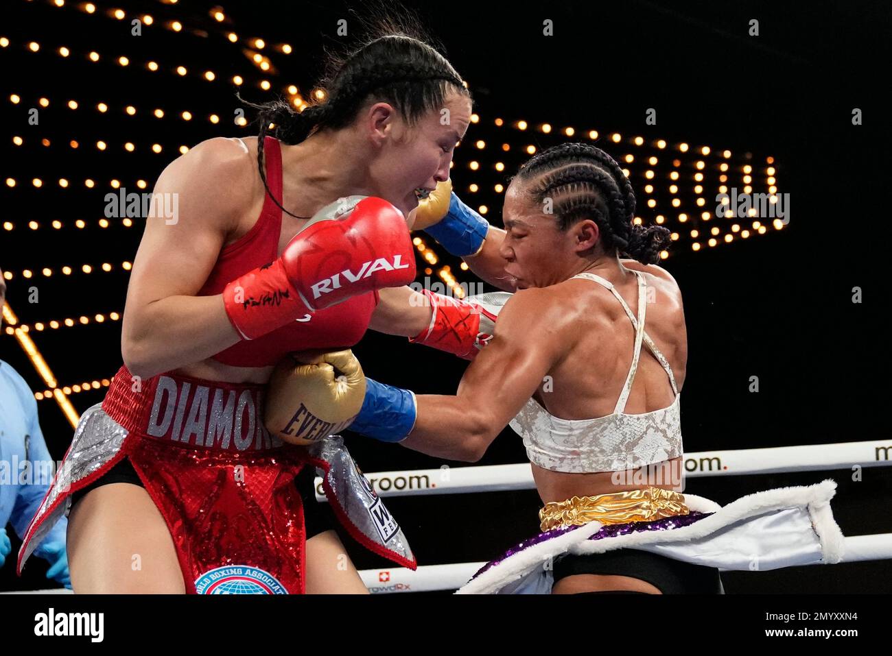 Alycia Baumgardner, right, punches Elhem Mekhaled, of France, during ...