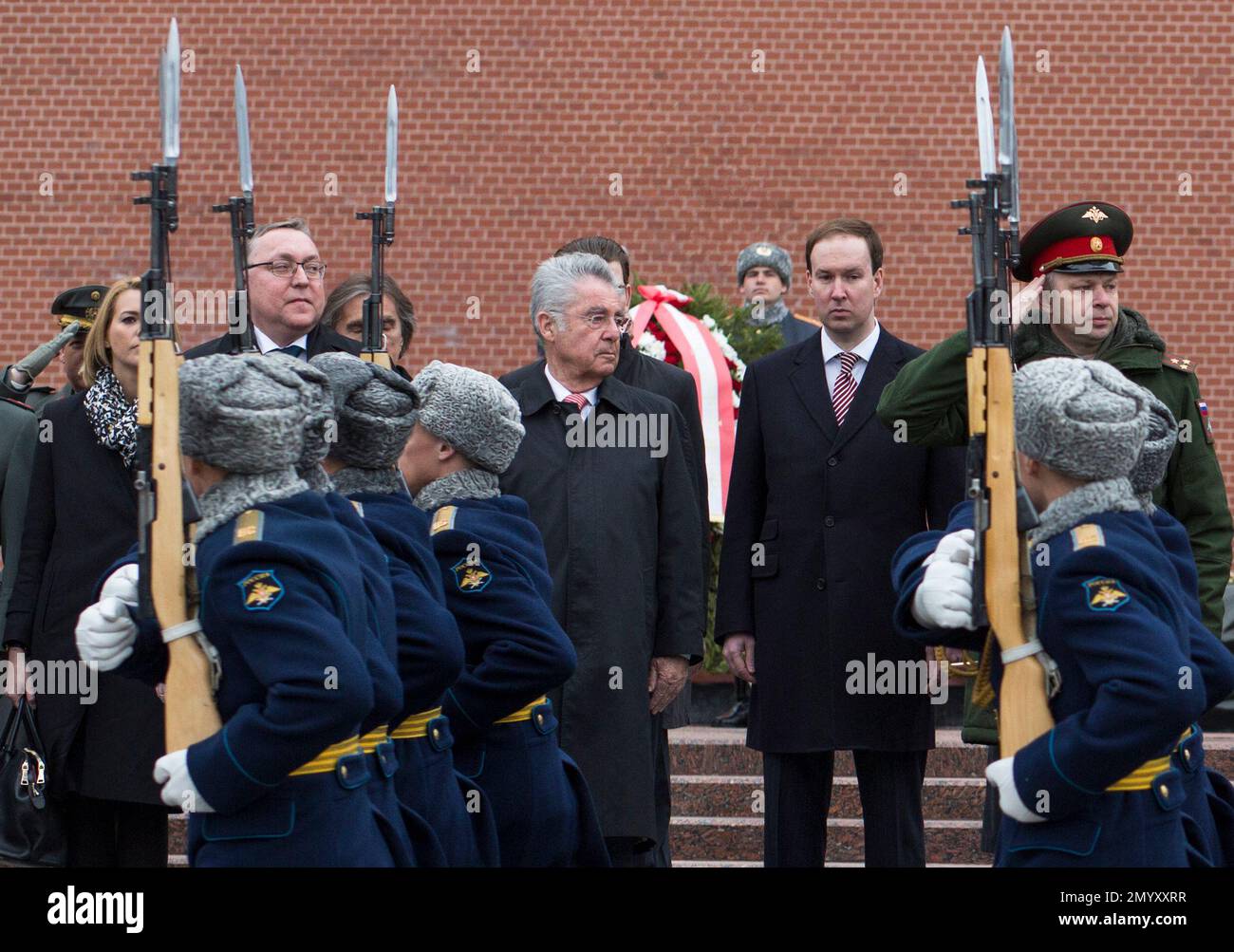 Austrian President Heinz Fischer, center, reviews an honor guard ...