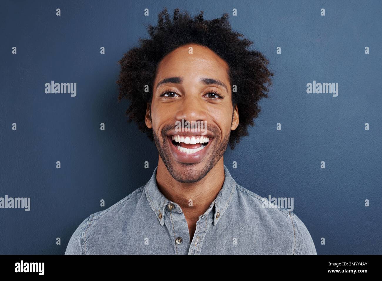 Cant beat that positivity. Portrait of a happy young man with a broad ...