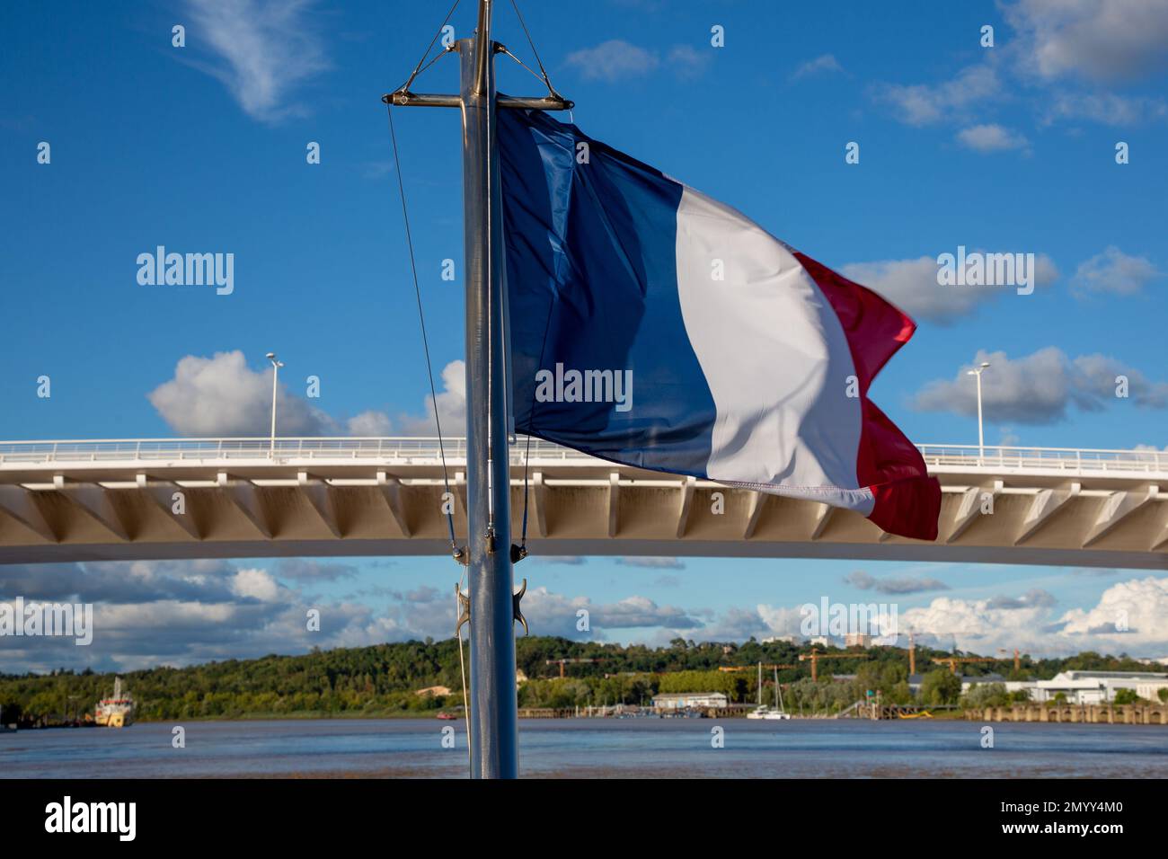 french flag red white blue view from Garonne river suspension bridge of ...