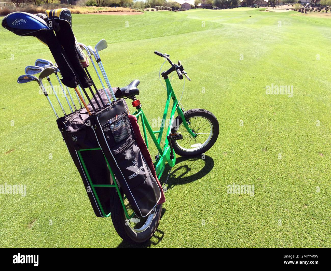 In this Feb. 25, 2016 photo, a golf bike stands on a golf course at ...