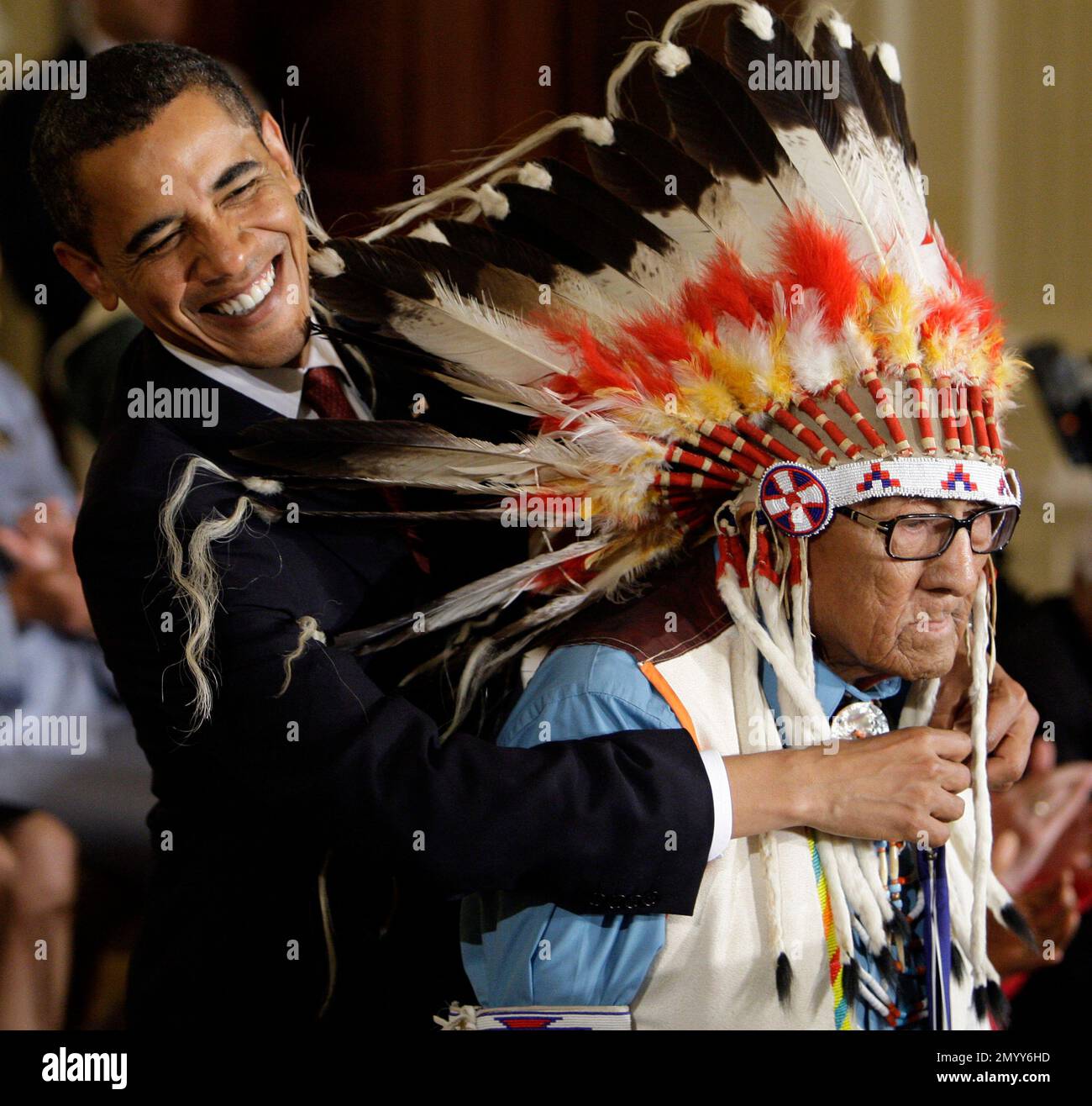 FILE - In this Aug. 12, 2009 file photo, President Barack Obama reaches ...