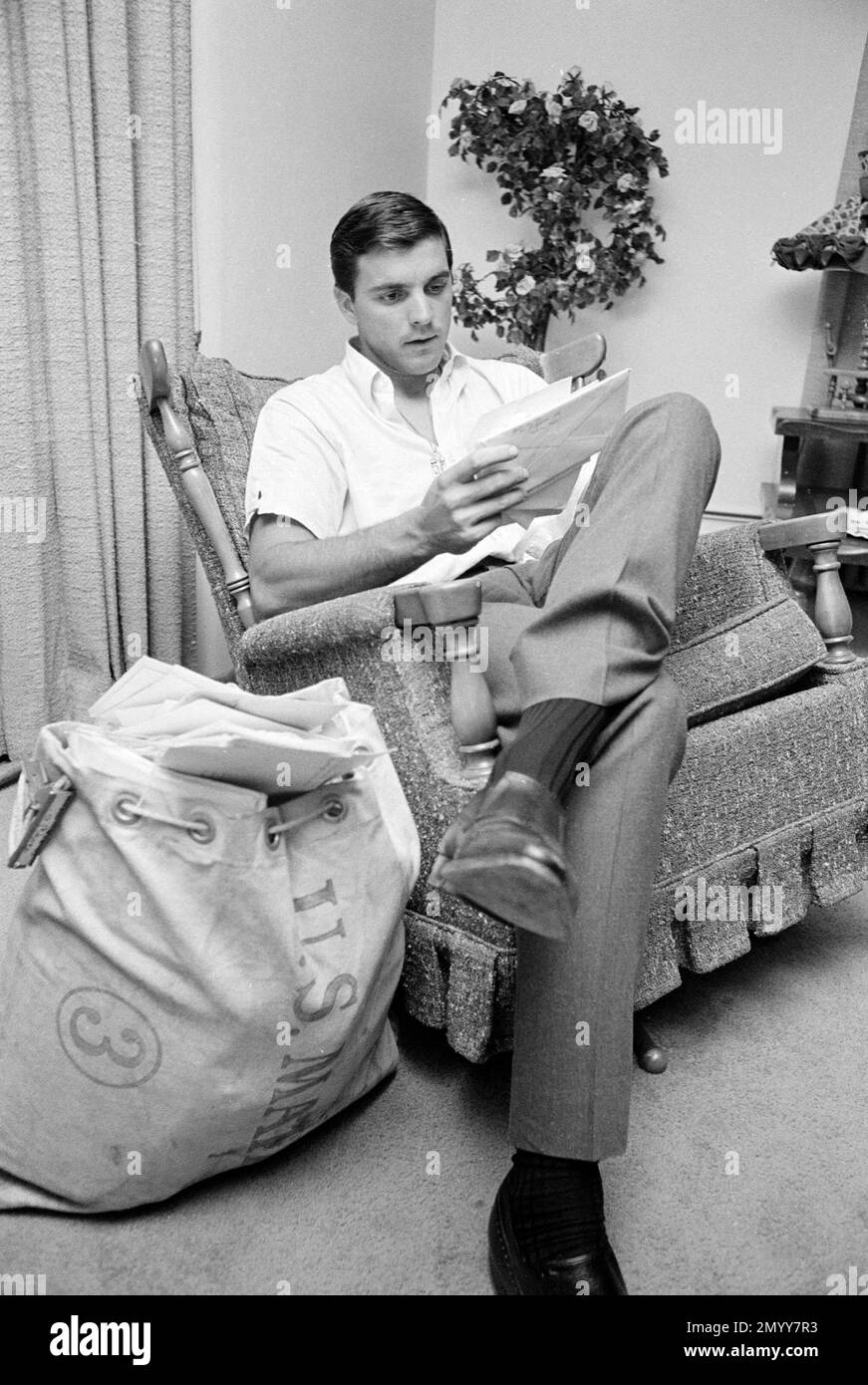 Boston Red Sox slugger Tony Conigliaro starts reading a bag full of fan ...