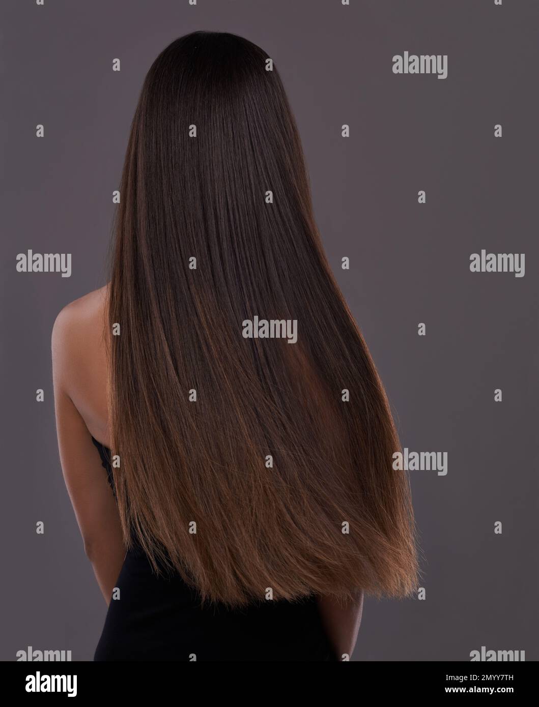 No split ends here. Rear view of a young woman with beautiful long hair ...