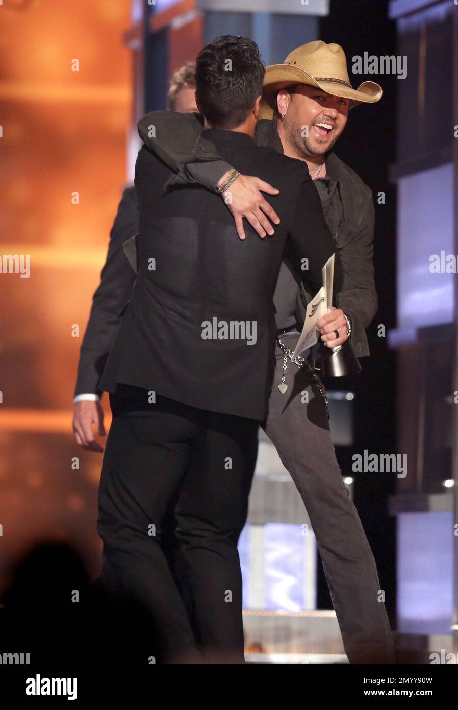 Jason Aldean, right, winner of the award for entertainer of the year ...