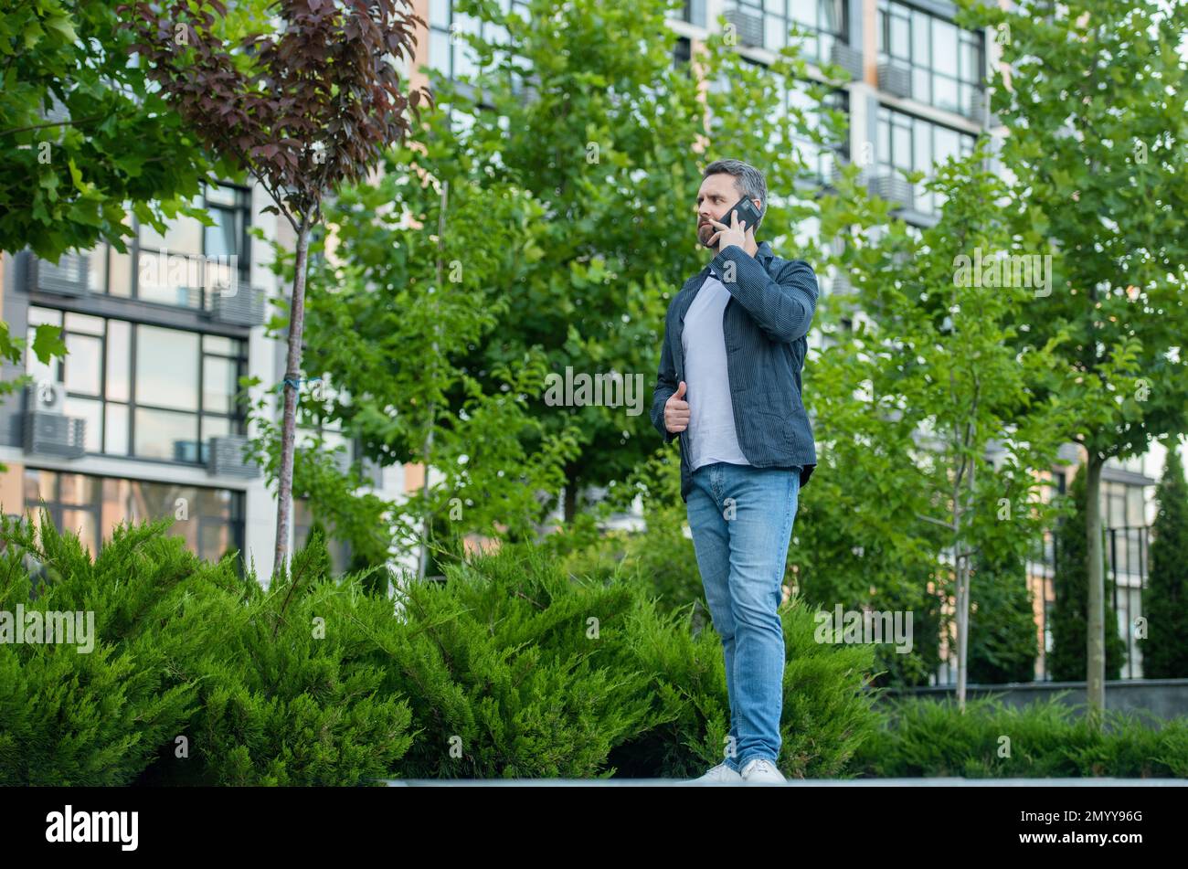 man having smartphone call in the street, banner. man call on ...