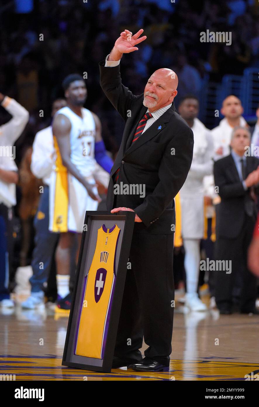 Los Angeles Lakers trainer Gary Vitti waves to fans as he was honored ...