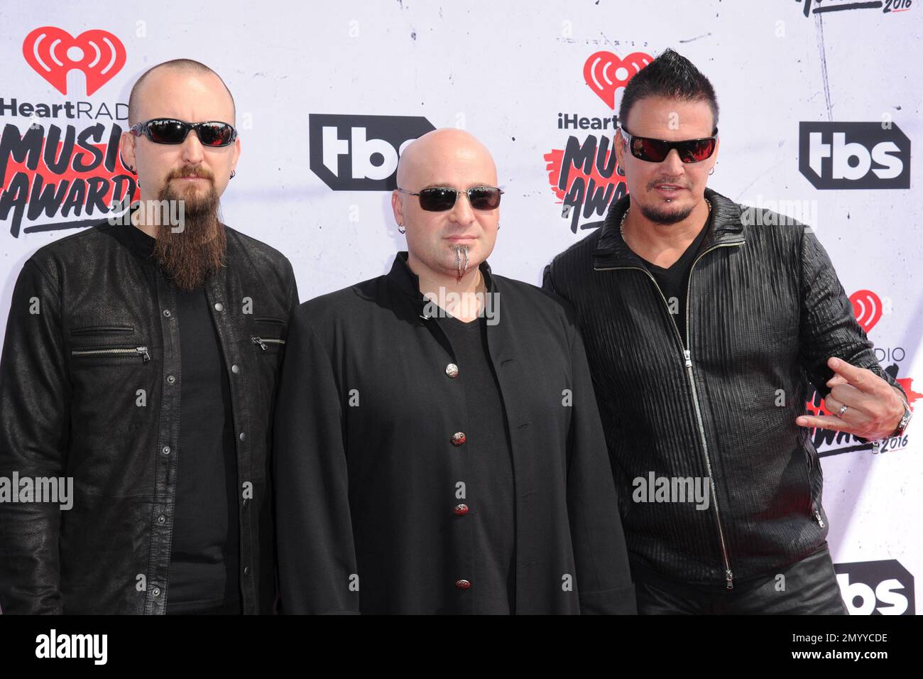 Mike Wengren, from left, David Draiman, and Dan Donegan of Disturbed ...