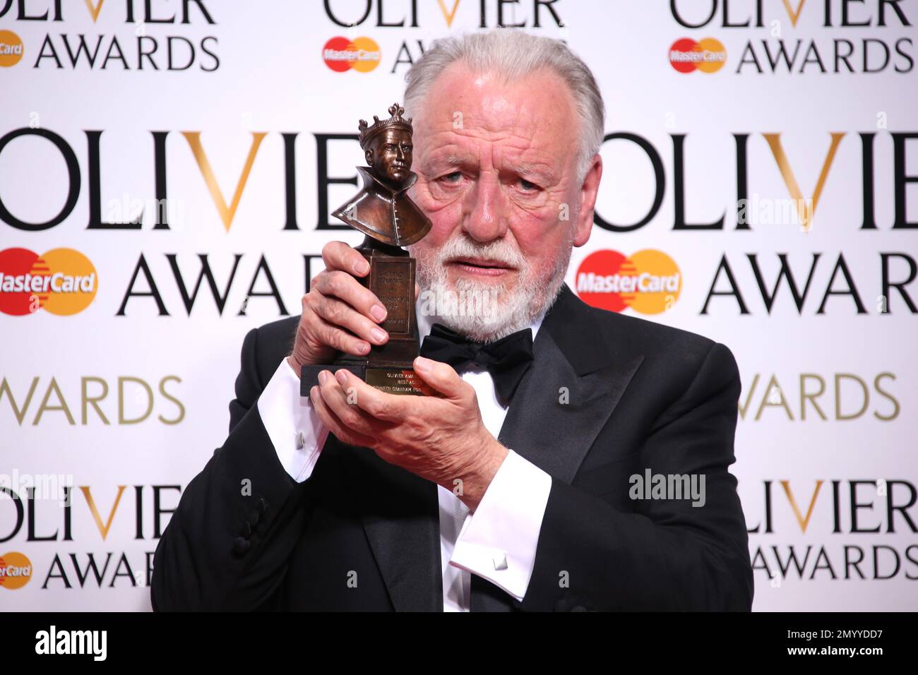 Actor Kenneth Cranham holds his Best Actor award for his performance in ...