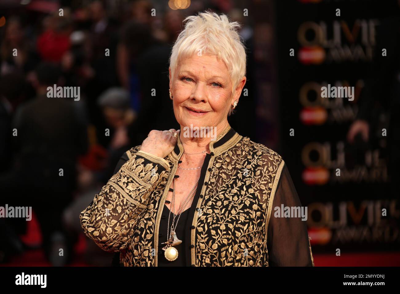 Actress Dame Judi Dench poses for photographers upon arrival at the ...