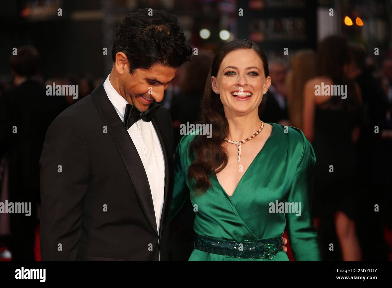 Actors Raza Jaffrey, left, and Lara Pulver poses for photographers upon ...