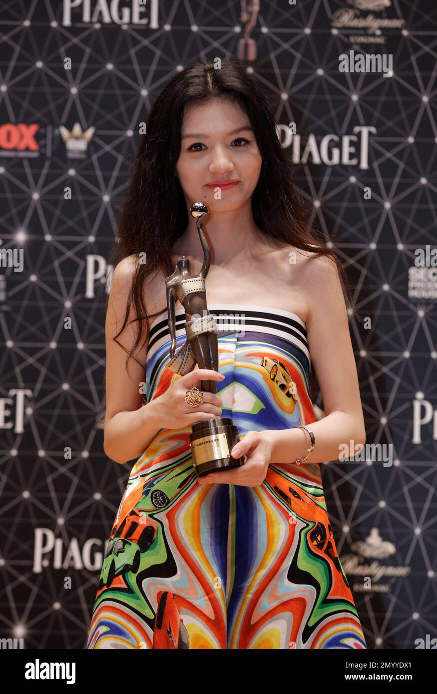 Chinese actress Jessie Li poses after winning the Best Actress award ...