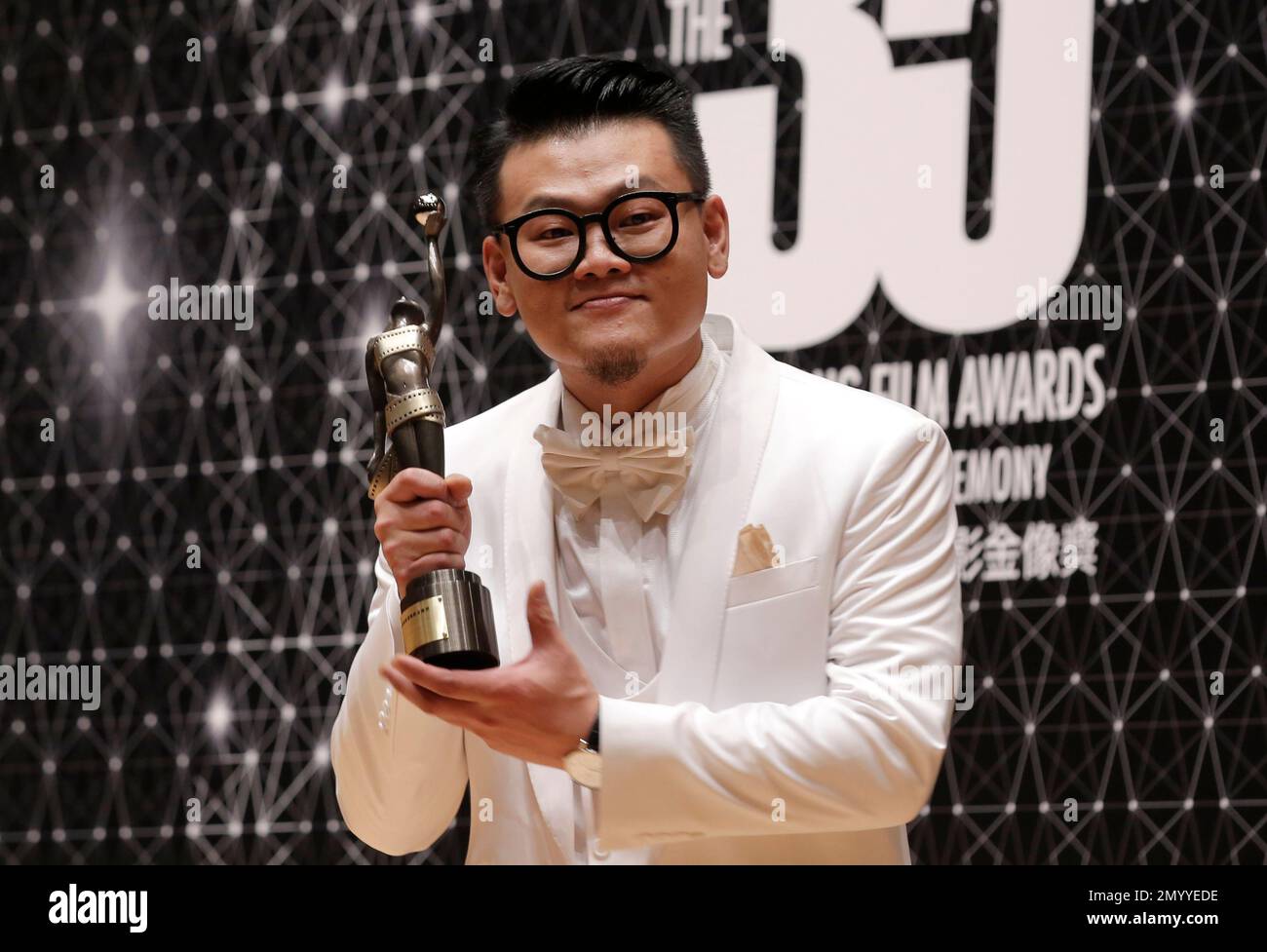 Hong Kong actor Michael Ning poses after winning the Best New Performer ...