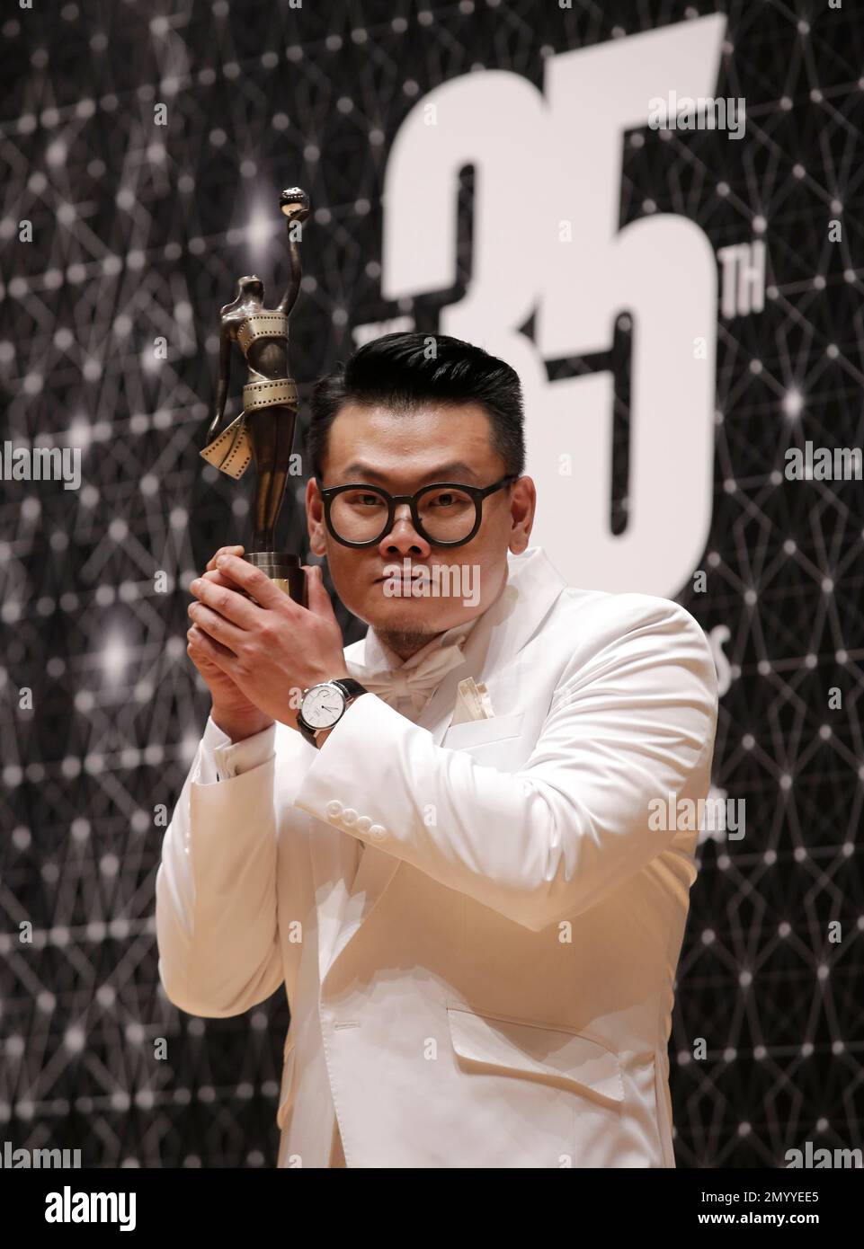 Hong Kong actor Michael Ning poses after winning the Best New Performer ...