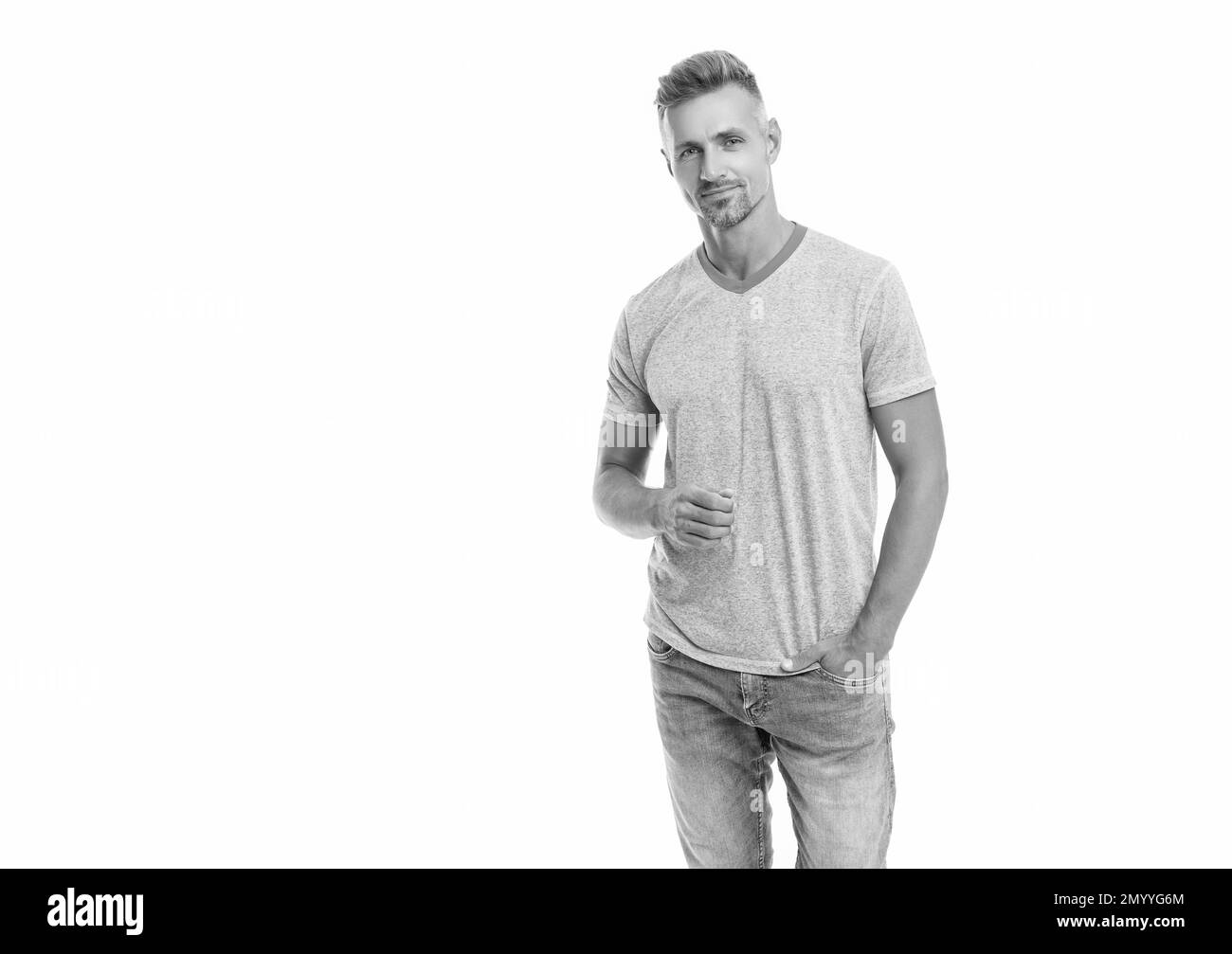 Happy caucasian guy in casual style pretend holding imaginary product ...