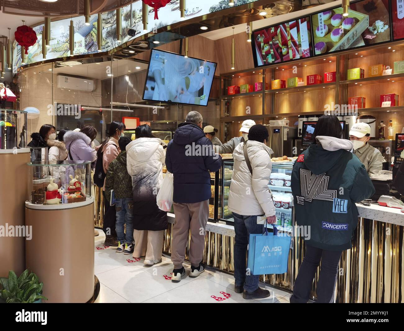 Beijing, China. 1st Feb, 2023. People line up to purchase pastries at a ...