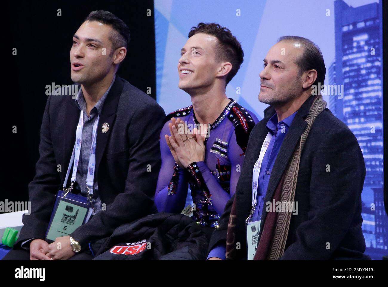 Adam Rippon, center, of the United States, reacts after competing in ...