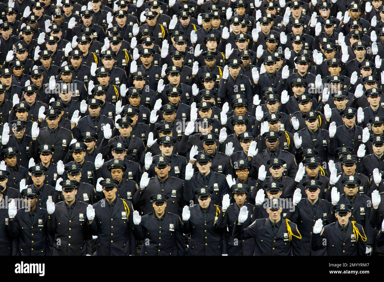 New police officers take the oath of office during the New York City ...