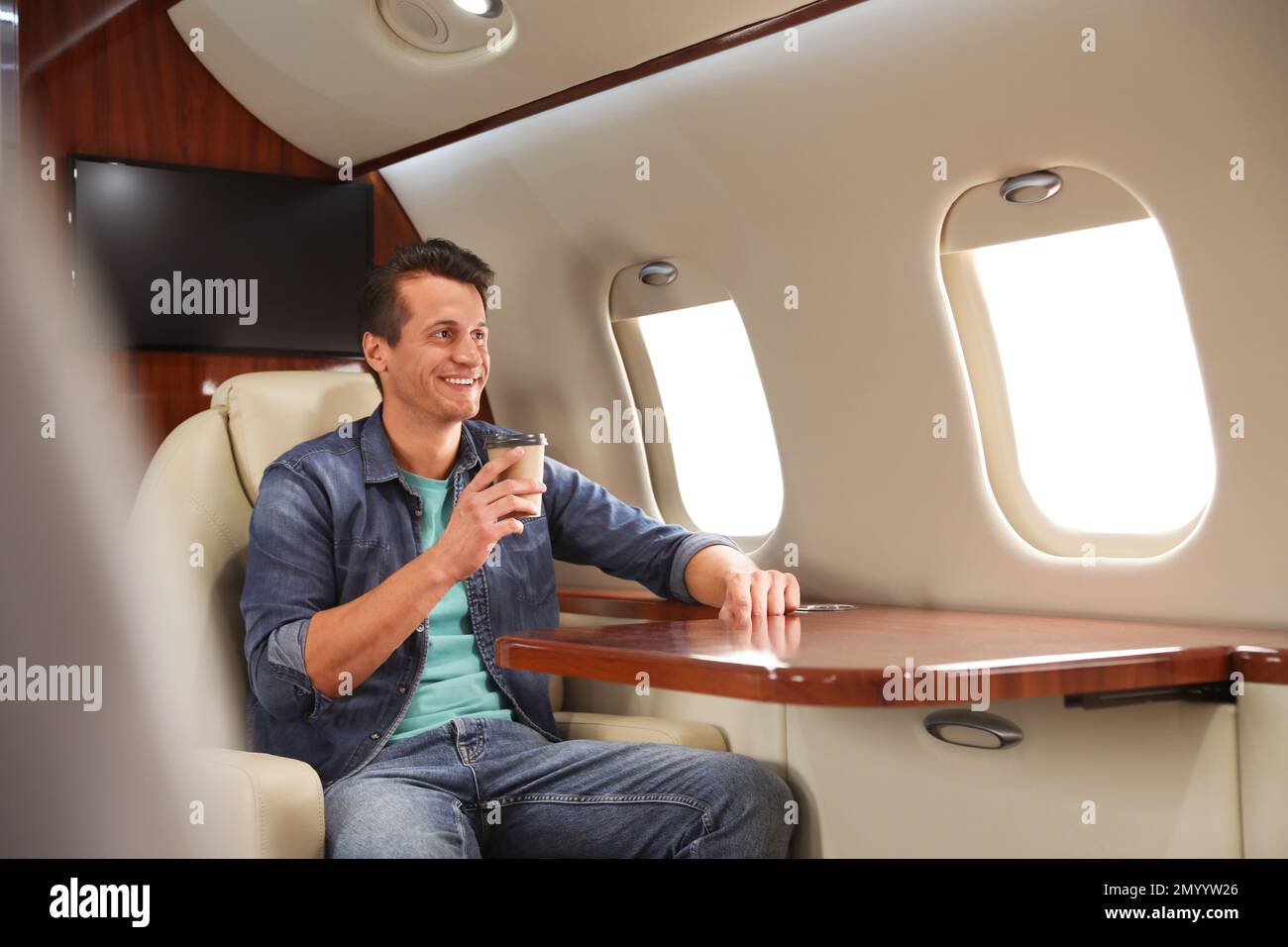 Man first class plane hi-res stock photography and images - Alamy