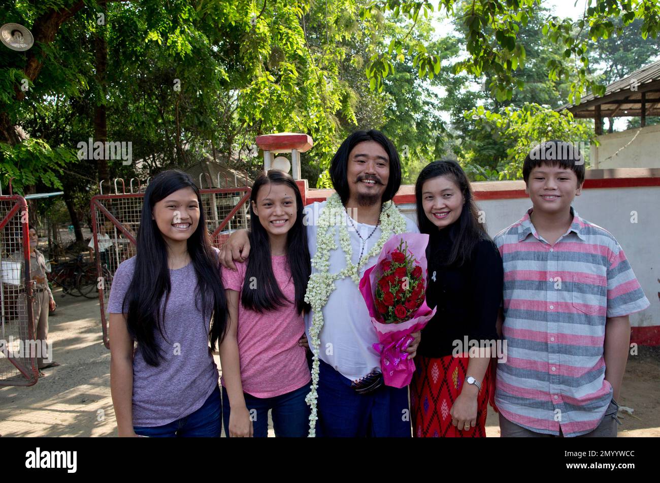 Ethnic Kachin activist Patrick Kum Ja Lee, center, and his wife and prominent Human Rights ...