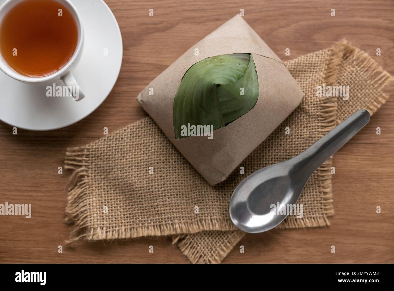 Nasi lemak , a popular malaysia breakfast serve with a cup of tea Stock ...