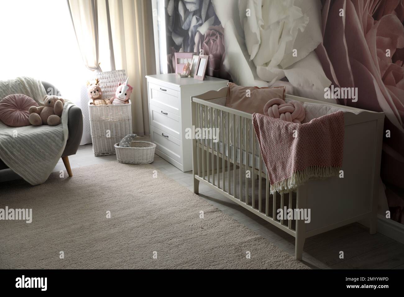 Baby room interior with stylish crib and floral wallpaper Stock Photo ...