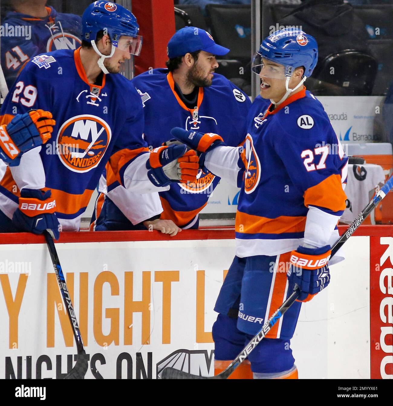 Teammates congratulate New York Islanders Anders Lee after Lee scored ...
