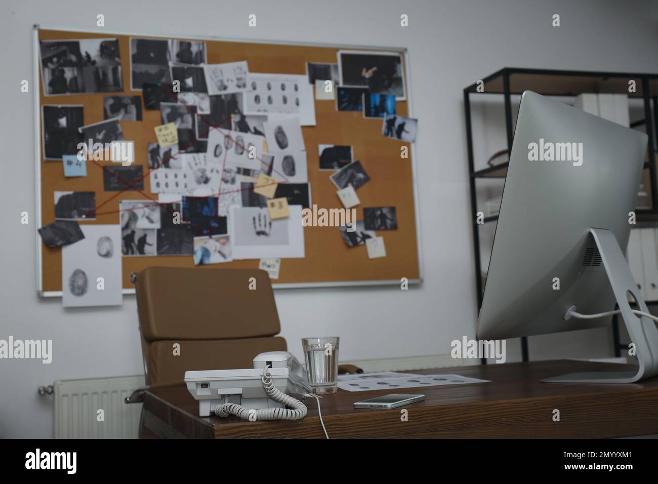Modern detective office with computer and board Stock Photo - Alamy