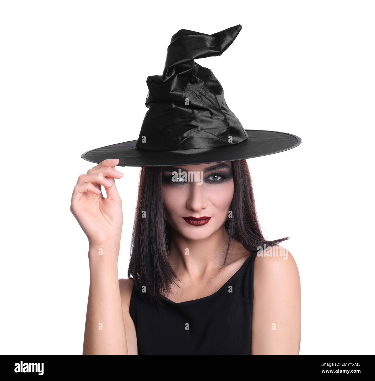 Mysterious witch wearing hat on white background Stock Photo - Alamy