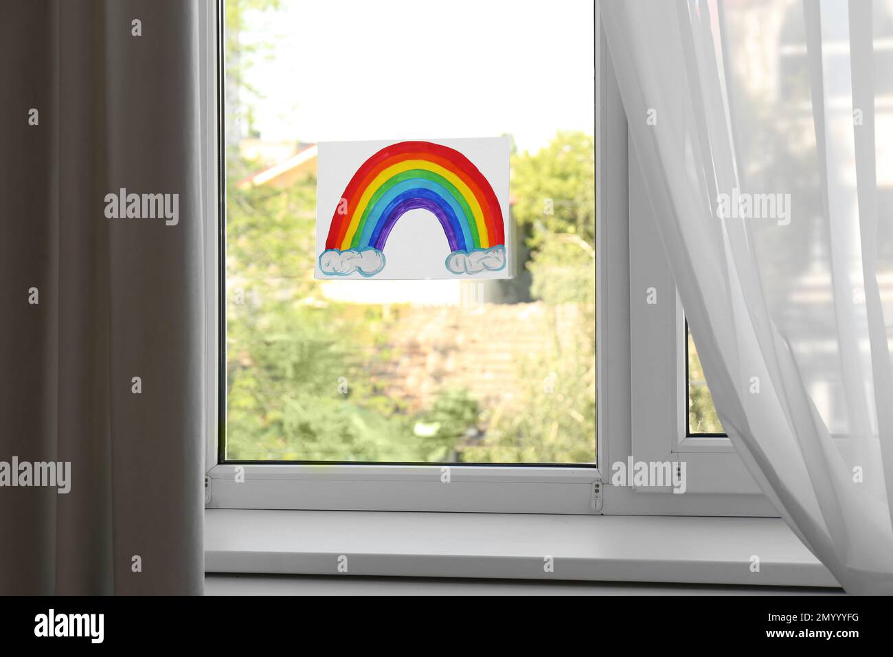 Picture of rainbow on window glass indoors. Stay at home concept Stock ...