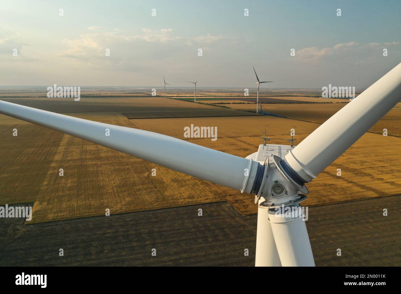 Modern windmill in wide field, closeup. Energy efficiency Stock Photo ...