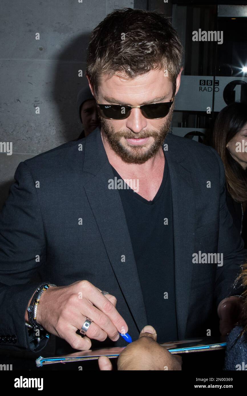 Chris Hemsworth signs autographs upon arrival at the BBC Broadcasting ...