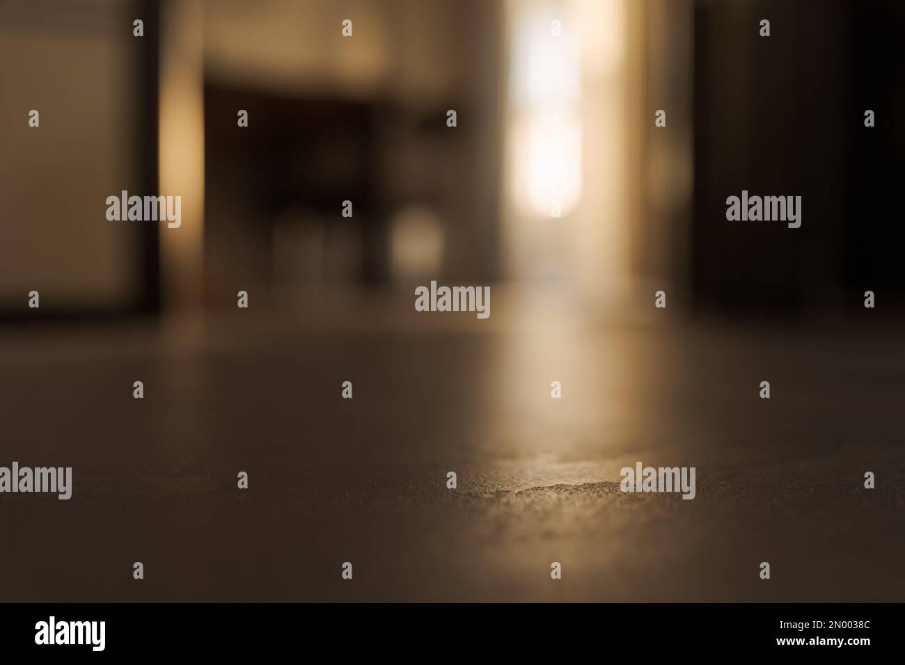 Dark indoor background with closeup focus on concrete floor, shallow ...