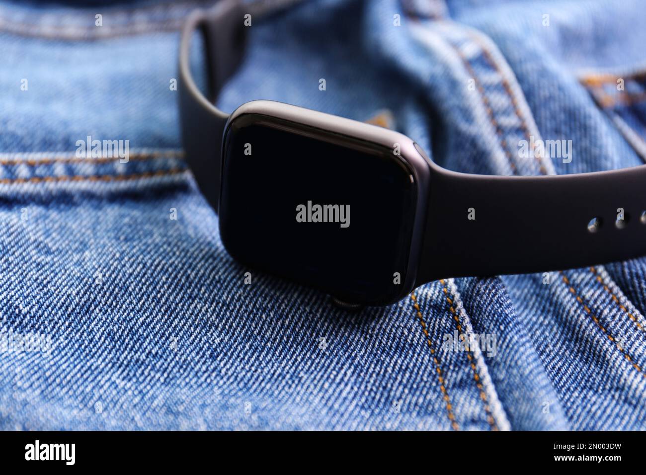 Modern stylish smart watch on jeans, closeup Stock Photo - Alamy