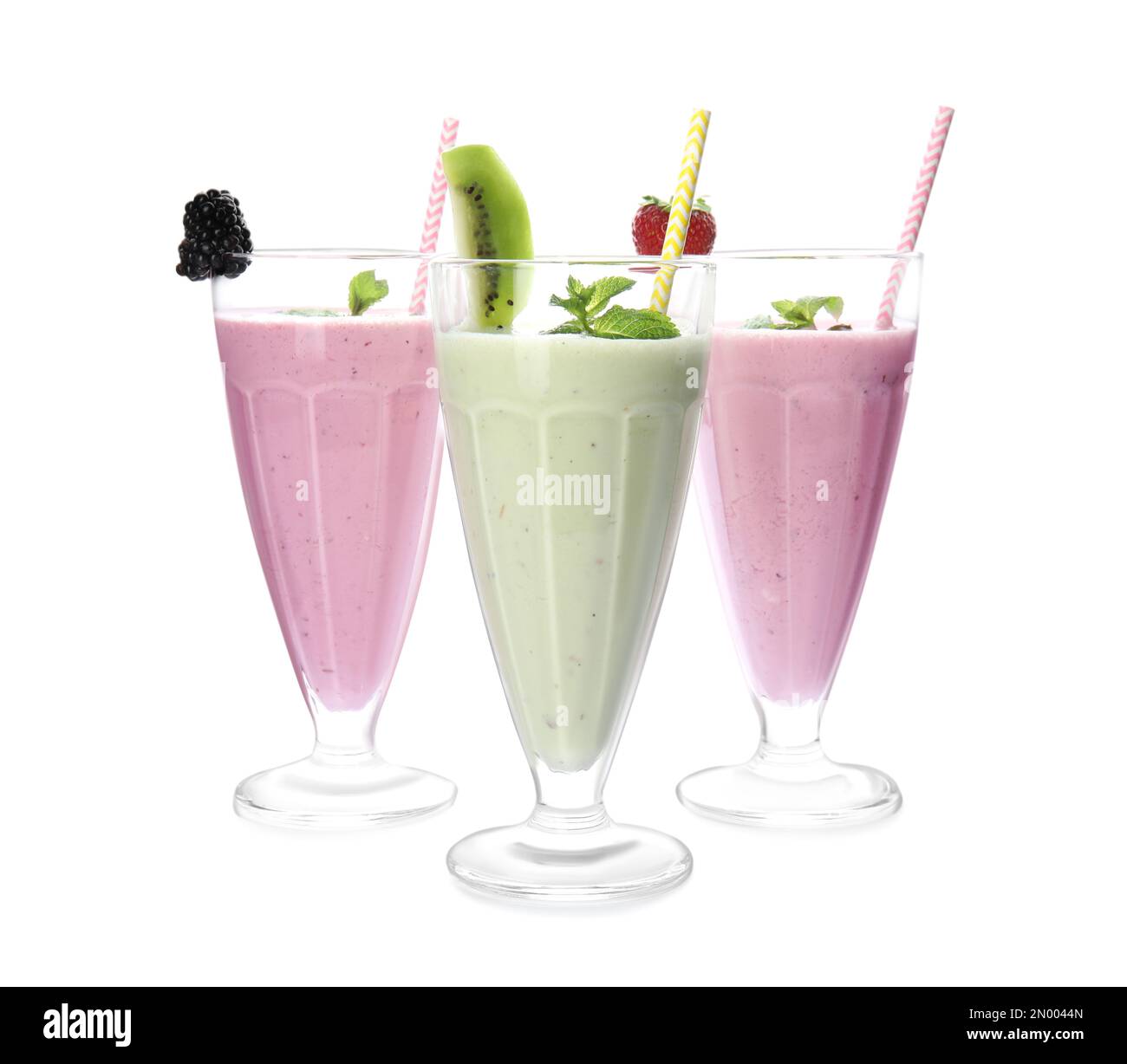 Tasty fresh milk shakes with berries on white background Stock Photo ...