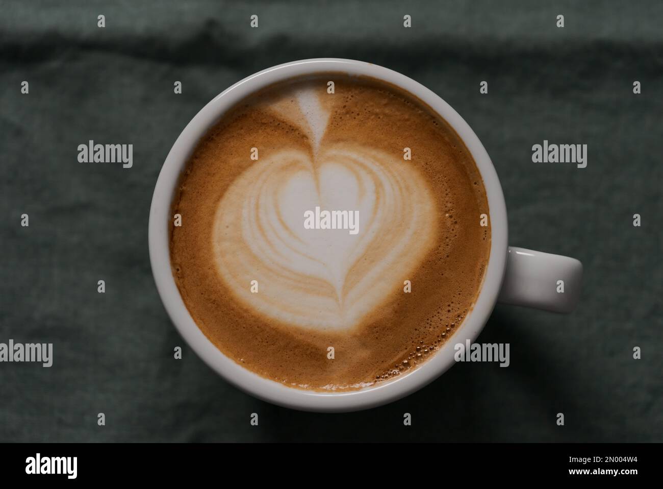 top down shot of flat white coffee in white cup, shallow focus Stock ...