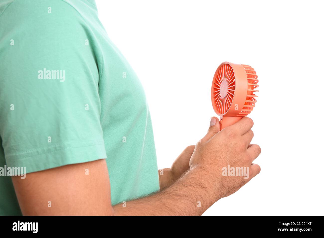 Man with portable fan on white background, closeup. Summer heat Stock ...
